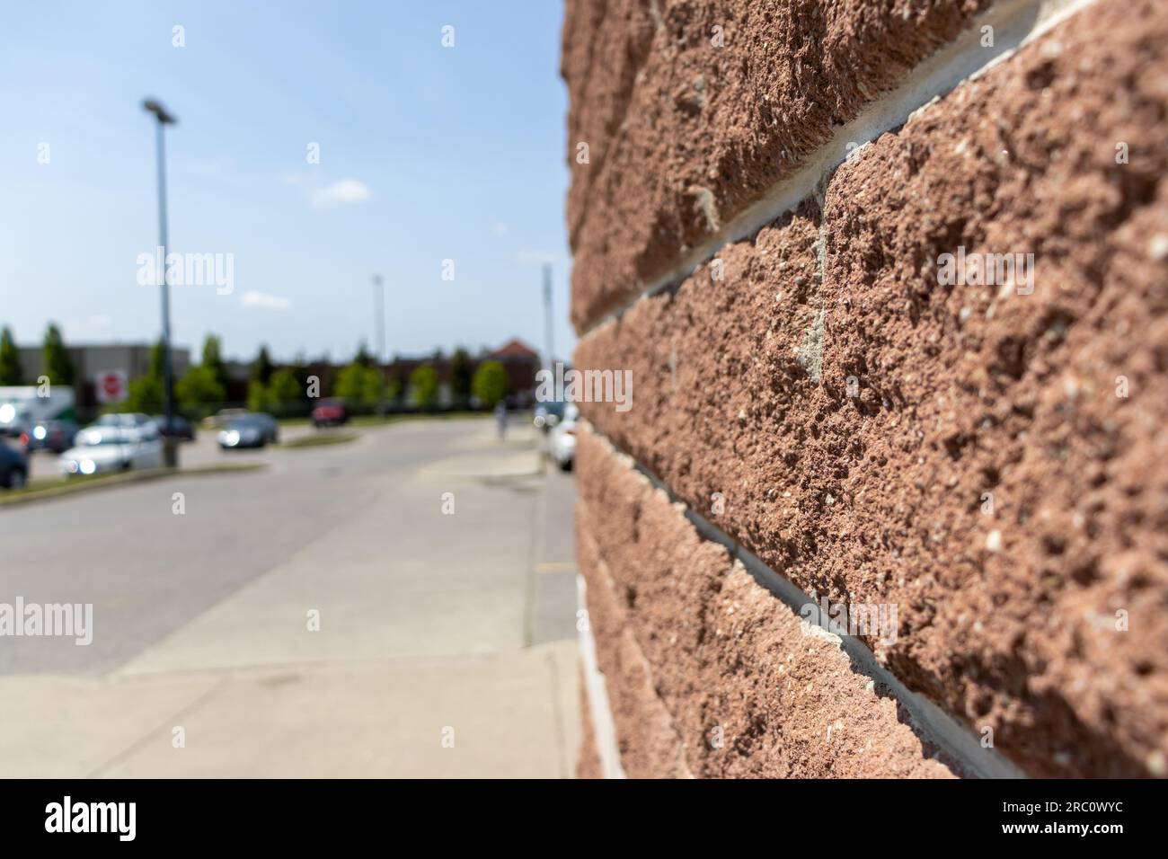 Side view of a red brick wall - building exterior - blurred background ...