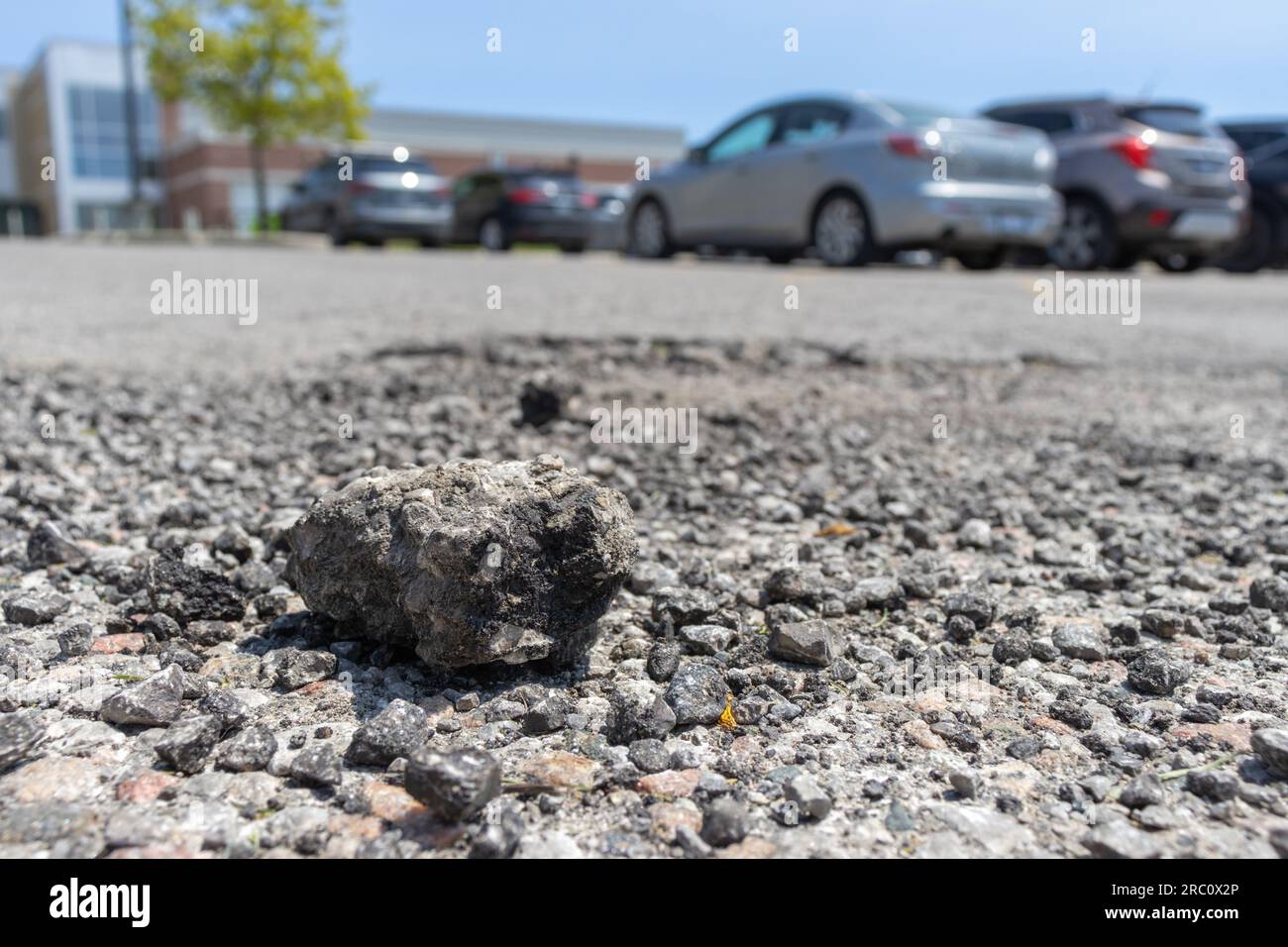 Small rock on road - rough texture close up background. Taken in ...