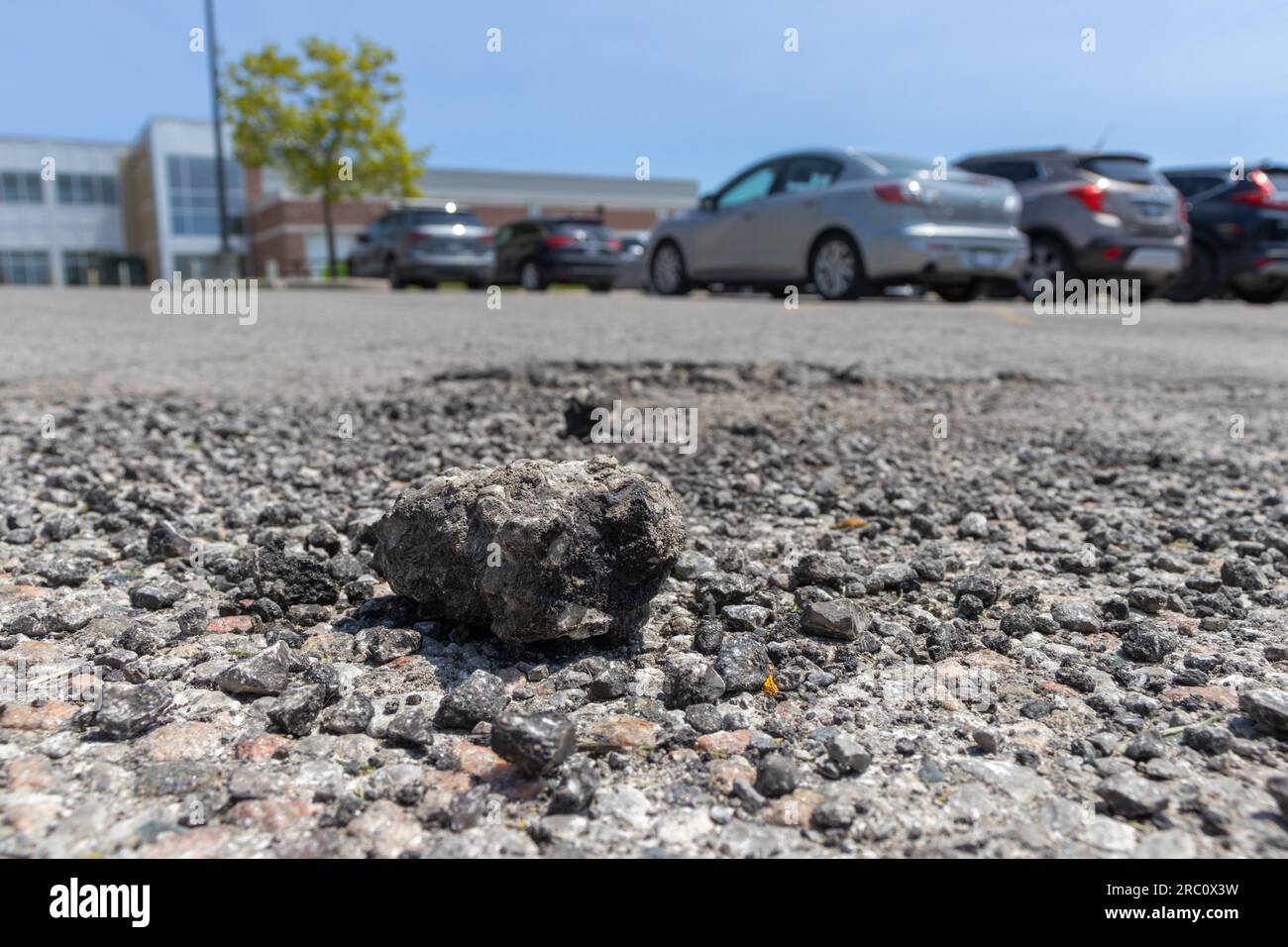 Small rock on road - rough texture close up background. Taken in ...