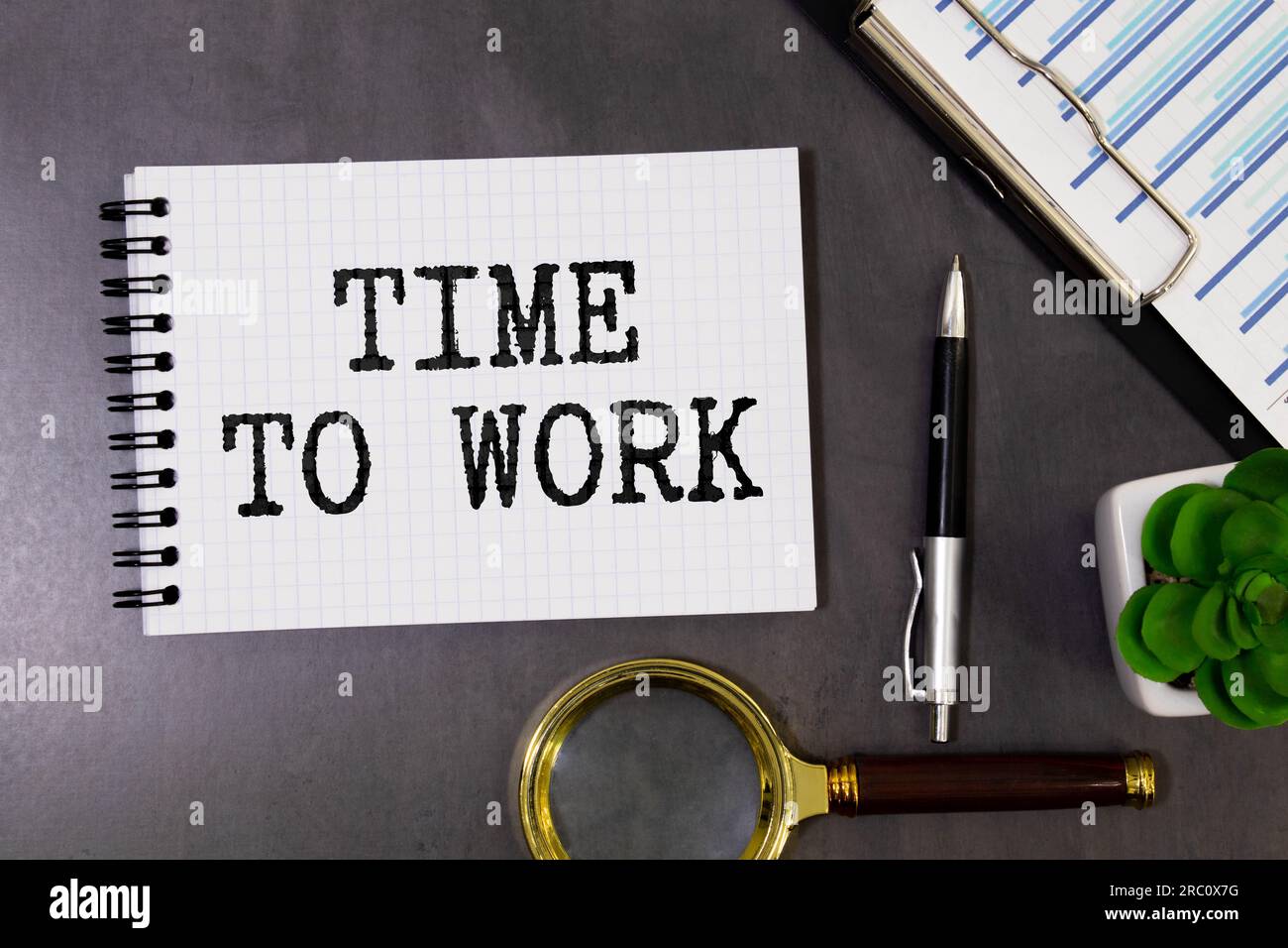 The text Work Time on a wooden blocks, lying on a Notepad with a metal ...