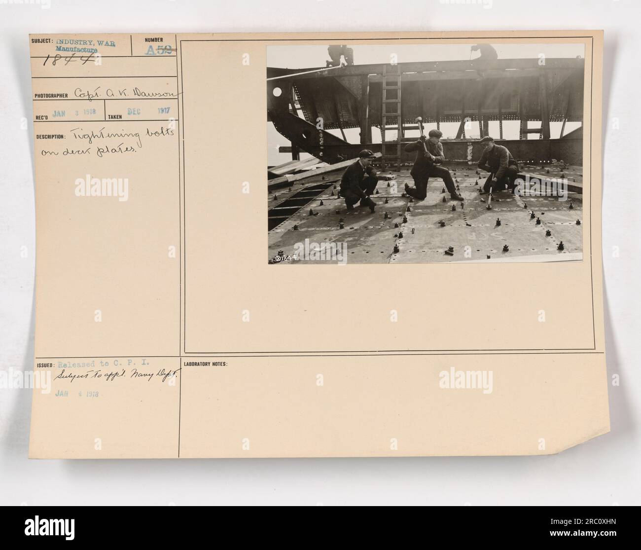 In this image, taken in December 1917, workers can be seen tightening ...