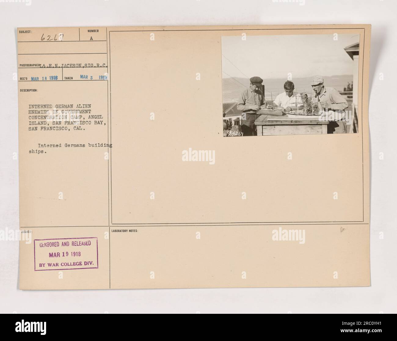 A group of interned German alien enemies is shown here constructing ...