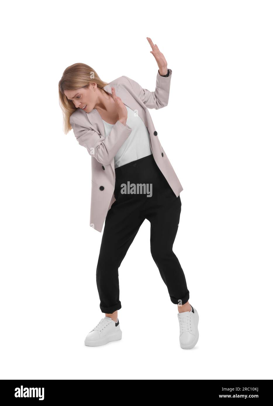 Beautiful businesswoman avoiding something on white background Stock ...