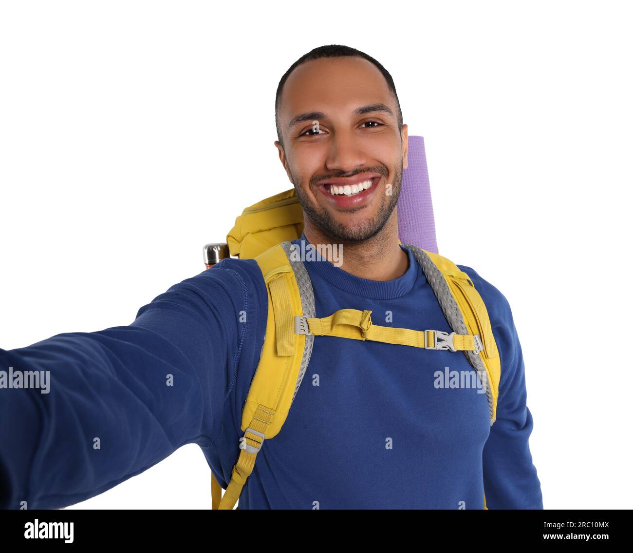 Happy tourist with backpack taking selfie on white background Stock ...