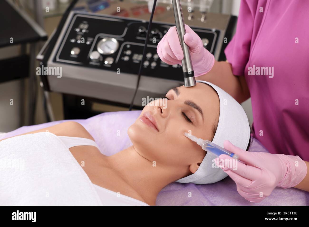Young woman undergoing cosmetic procedure in beauty salon. Microcurrent therapy Stock Photo - Alamy