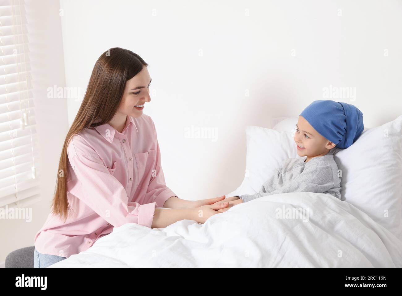Childhood cancer. Mother and daughter in hospital Stock Photo - Alamy