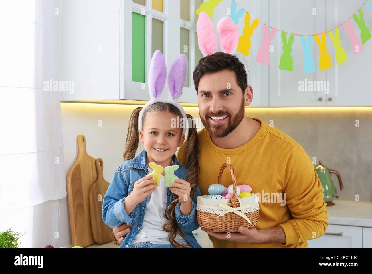 Father and his daughter with Easter eggs in kitchen Stock Photo - Alamy