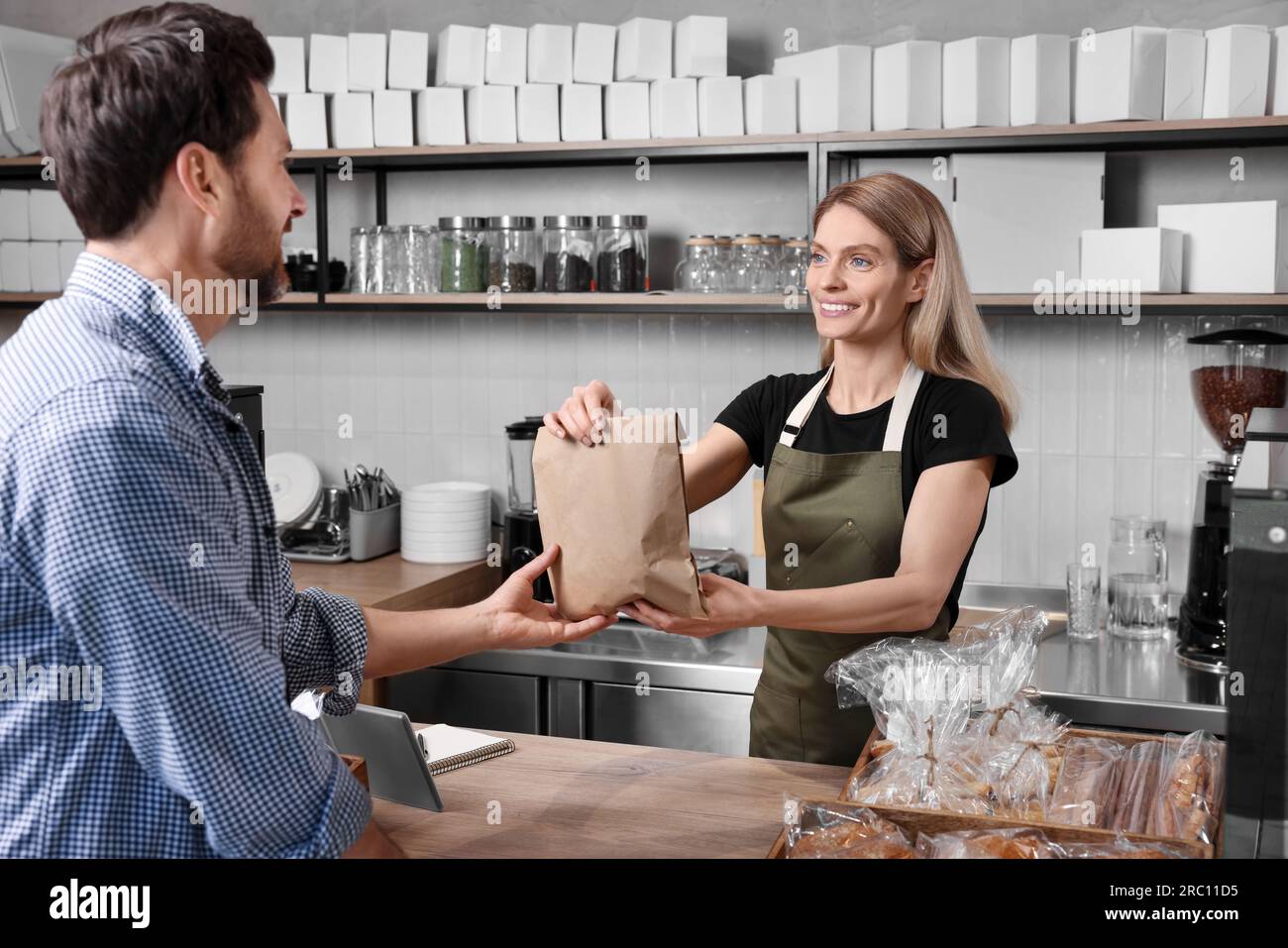 Man buying fresh pastries in bakery shop Stock Photo - Alamy