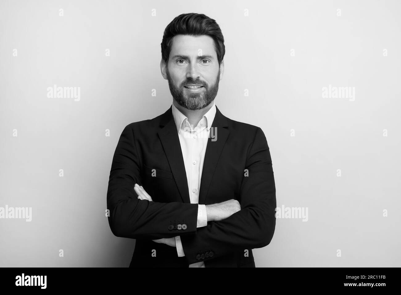 Portrait of handsome man on light background. Black and white effect ...
