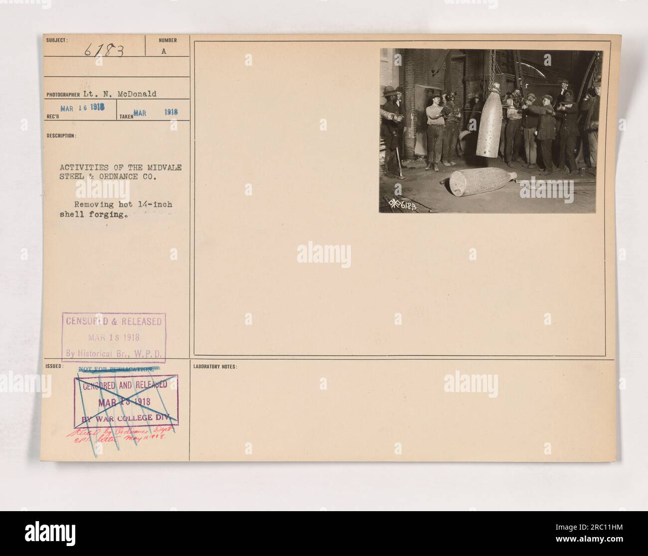 Manufacturing process of big shells during World War One. In this photo ...