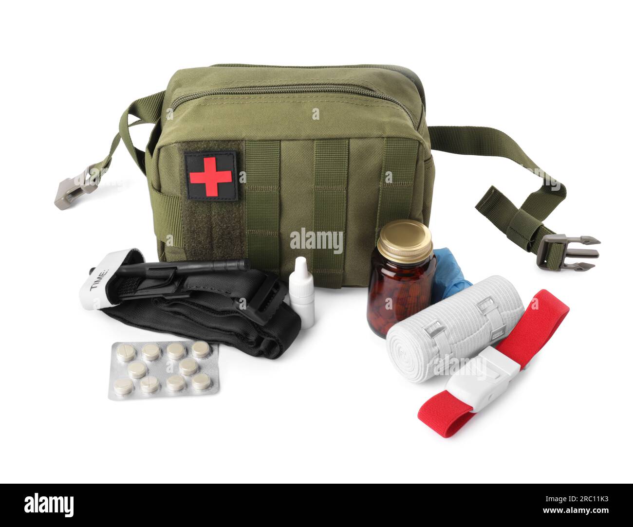 Military first aid kit, tourniquet, pills and tools on white background ...