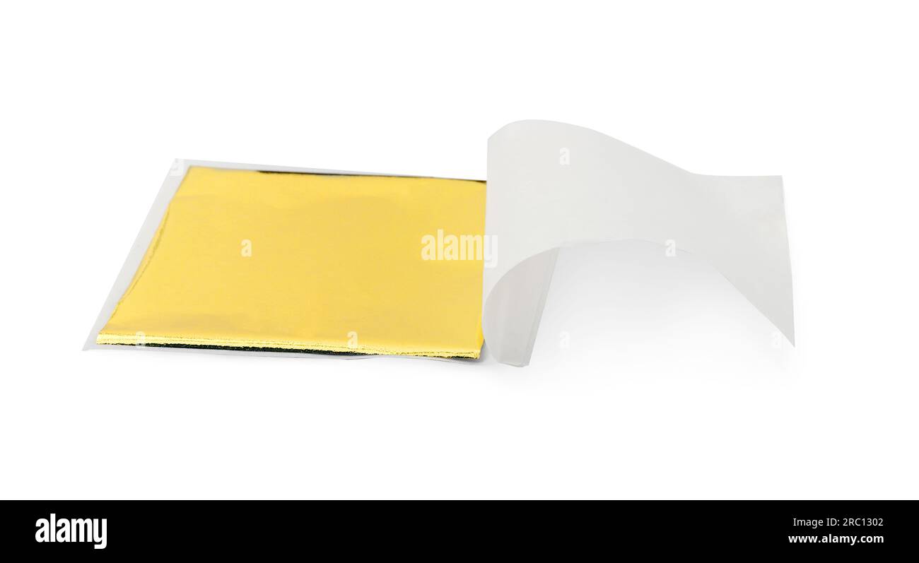 One edible gold leaf sheet isolated on white Stock Photo - Alamy
