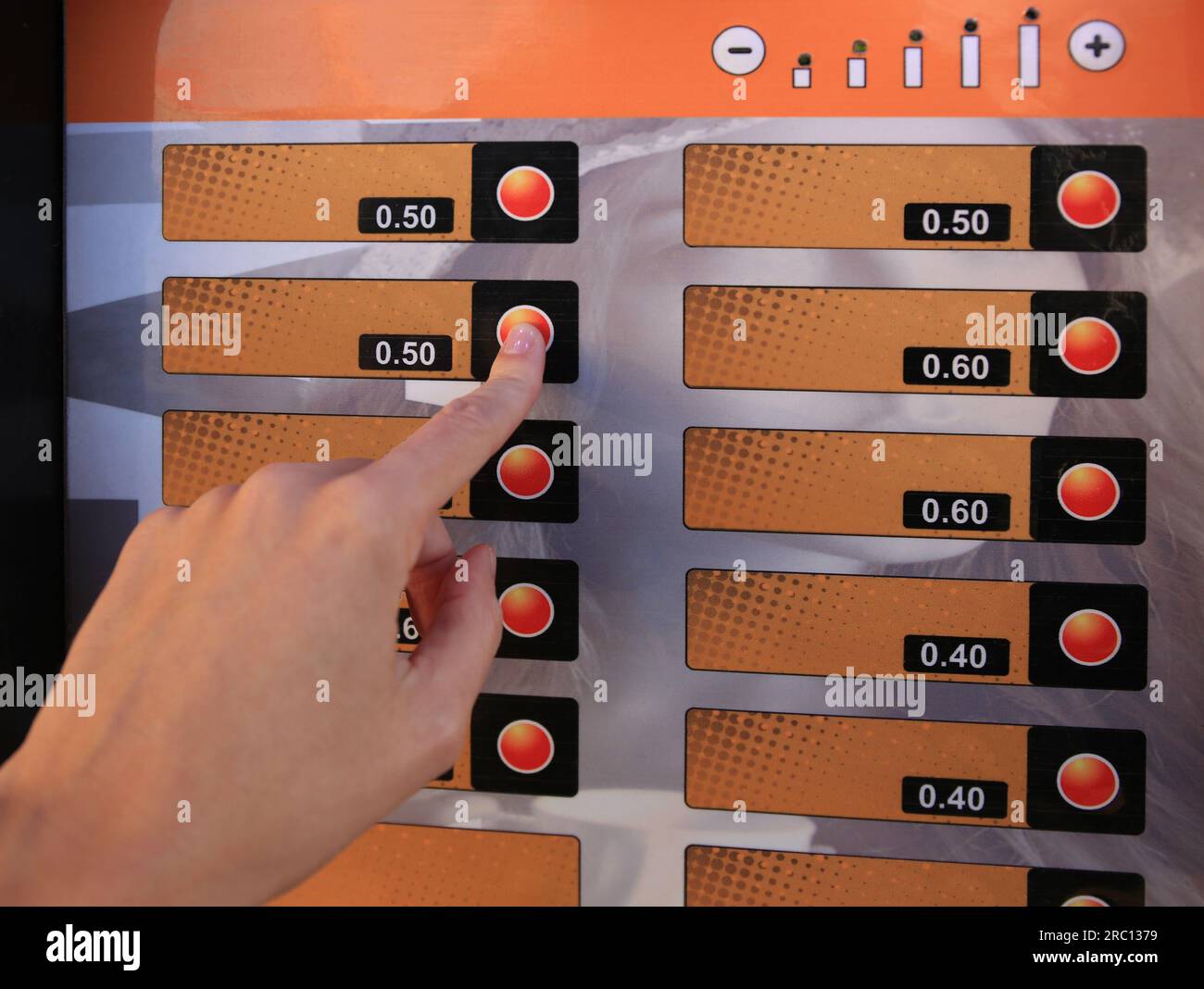 Using coffee vending machine. Woman pressing button to choose drink ...