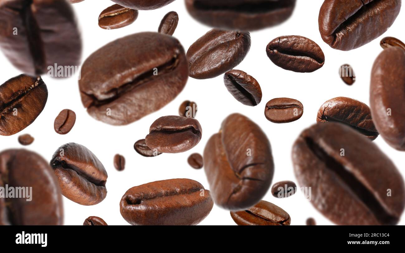Roasted coffee beans falling o white background Stock Photo - Alamy