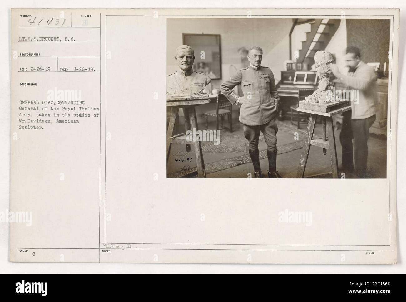Lieutenant H.S. Drucker, S.C., photographer, takes a portrait of ...