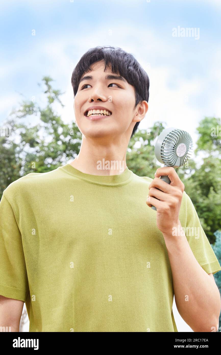 summer lifestyle, enjoying electric fan outdoor Stock Photo - Alamy