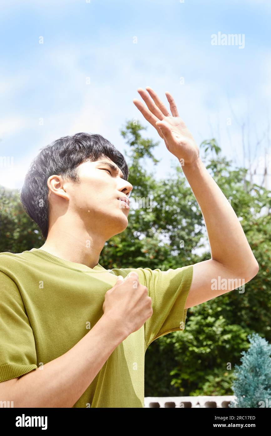 summer lifestyle, korean asian young man and shield the sun Stock Photo ...