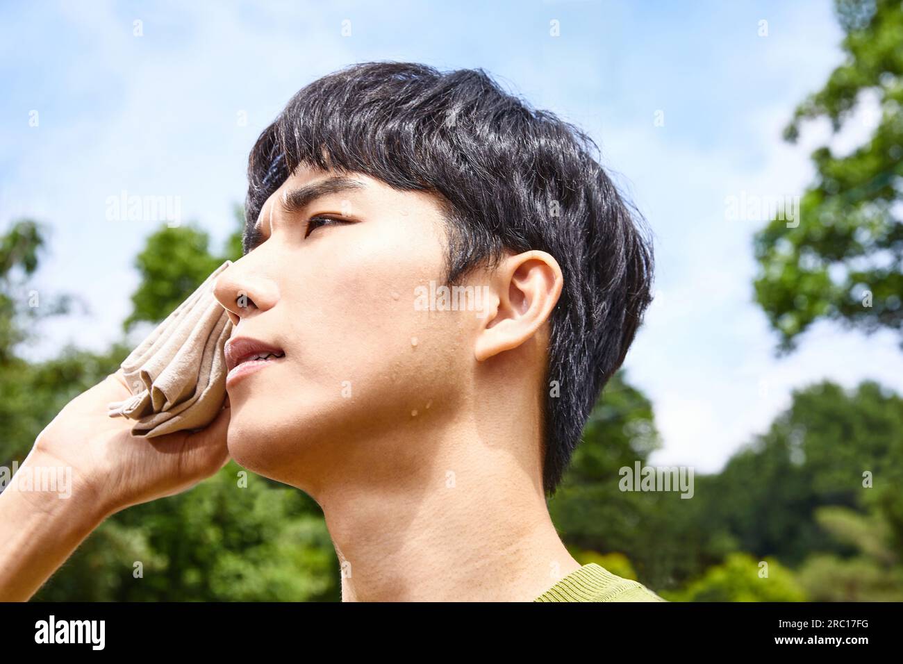 summer lifestyle, korean asian young man wiping sweat outdoor Stock ...
