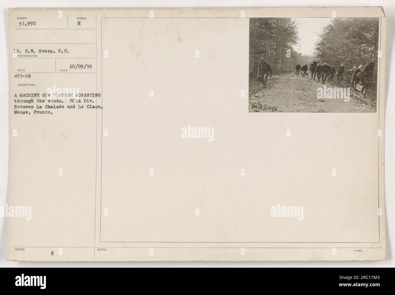 A machine gun platoon from the 80th Division is seen advancing through ...