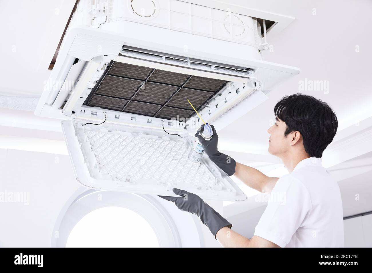 summer lifestyle, korean asian young man cleaning the air conditioner ...