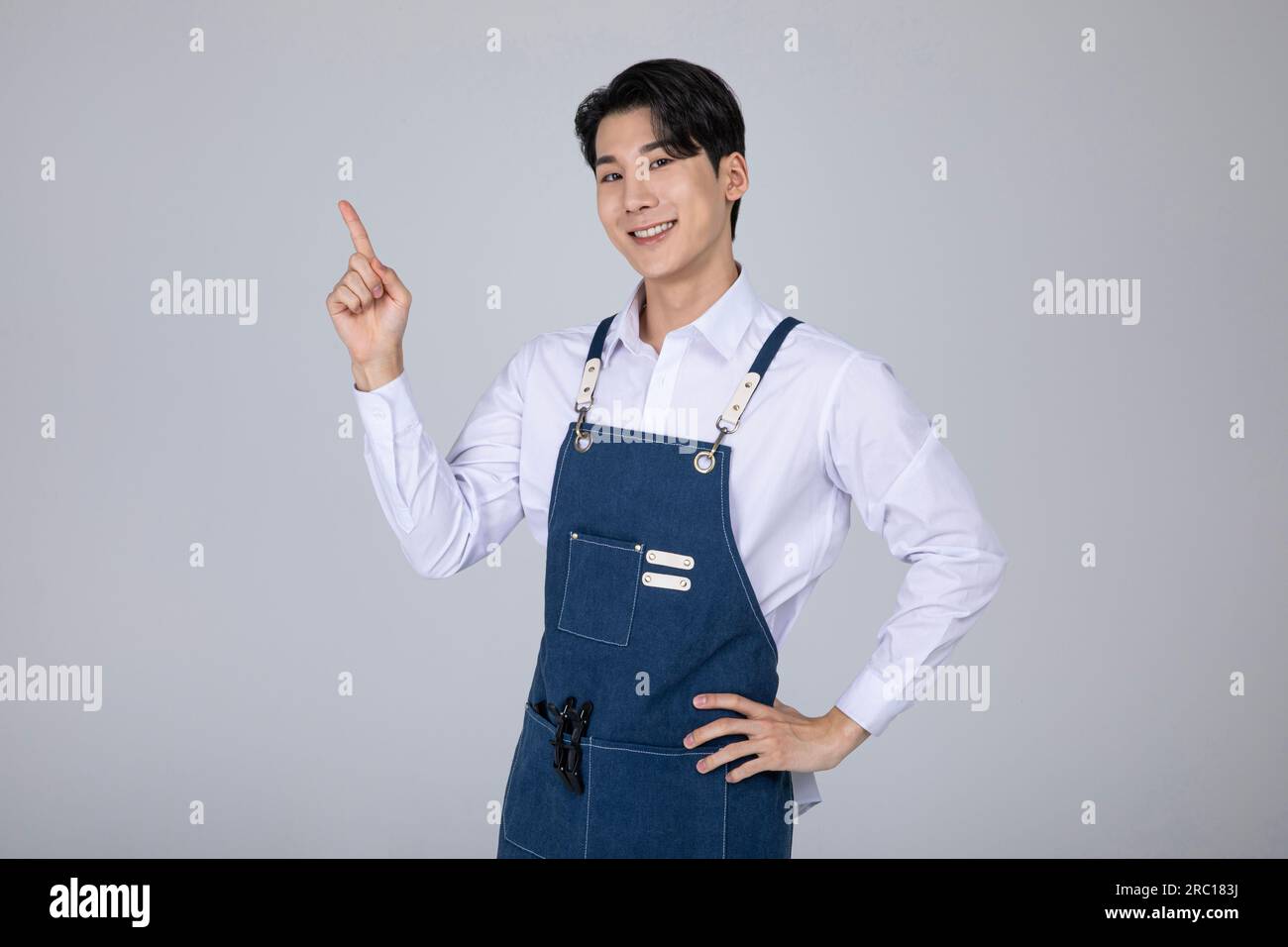 millennials and gen z, korean asian young man pointing Stock Photo - Alamy