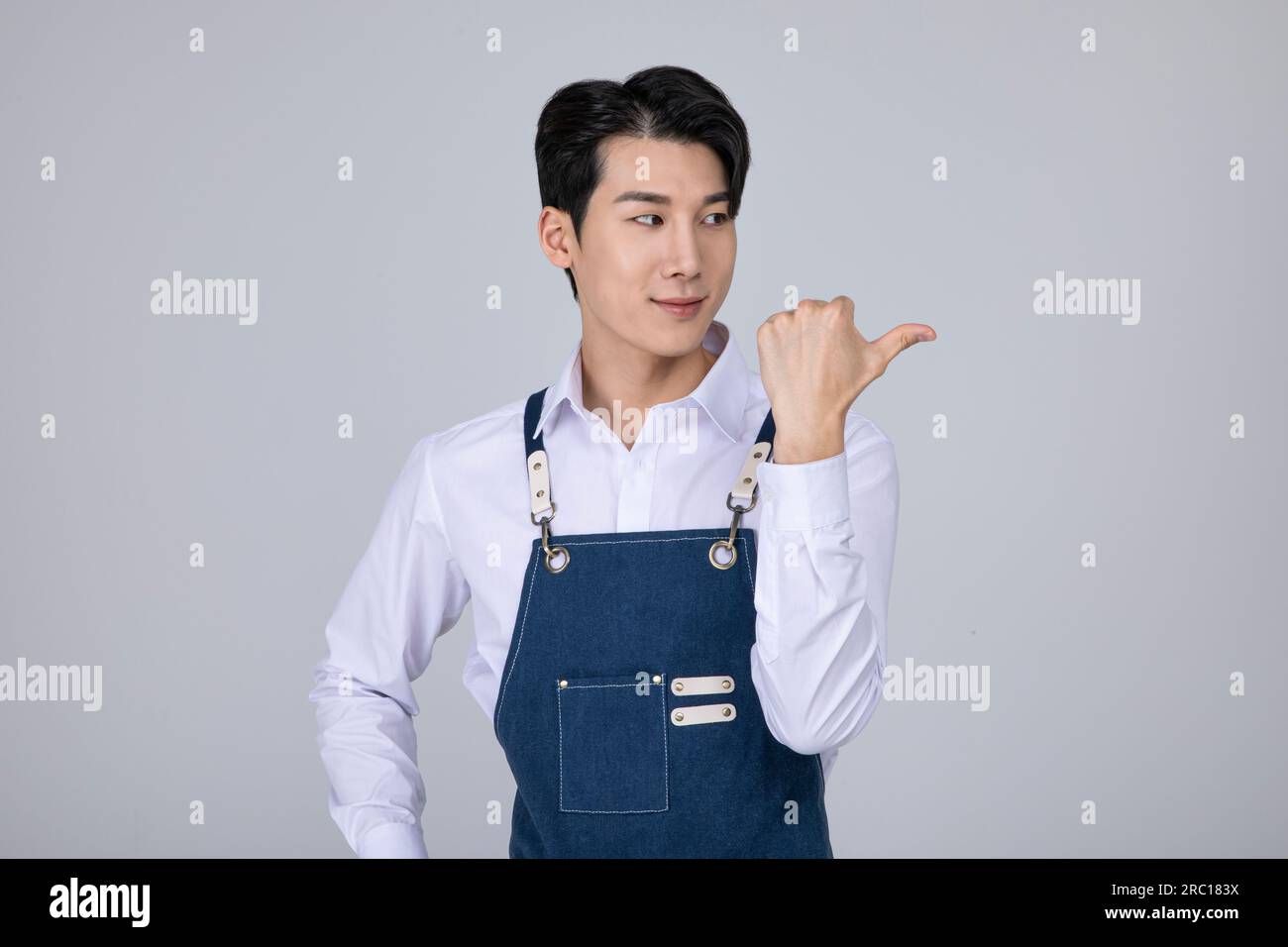 millennials and gen z, korean asian young man pointing Stock Photo - Alamy