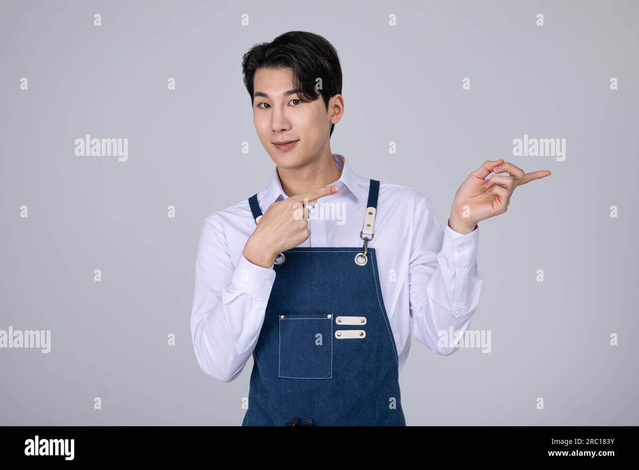 millennials and gen z, korean asian young man pointing Stock Photo - Alamy
