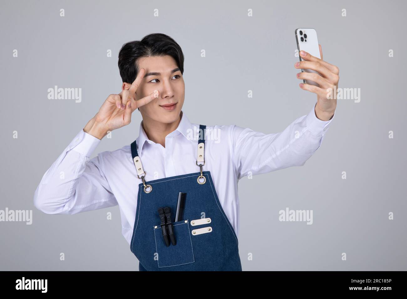 millennials and gen z, korean asian young man holding a smartphone ...