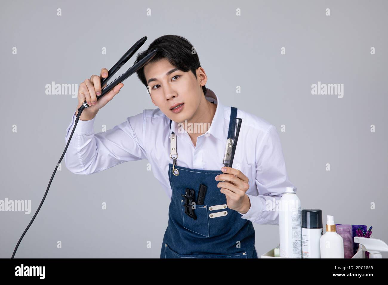 millennials and gen z, korean asian young man grooming his hair Stock ...