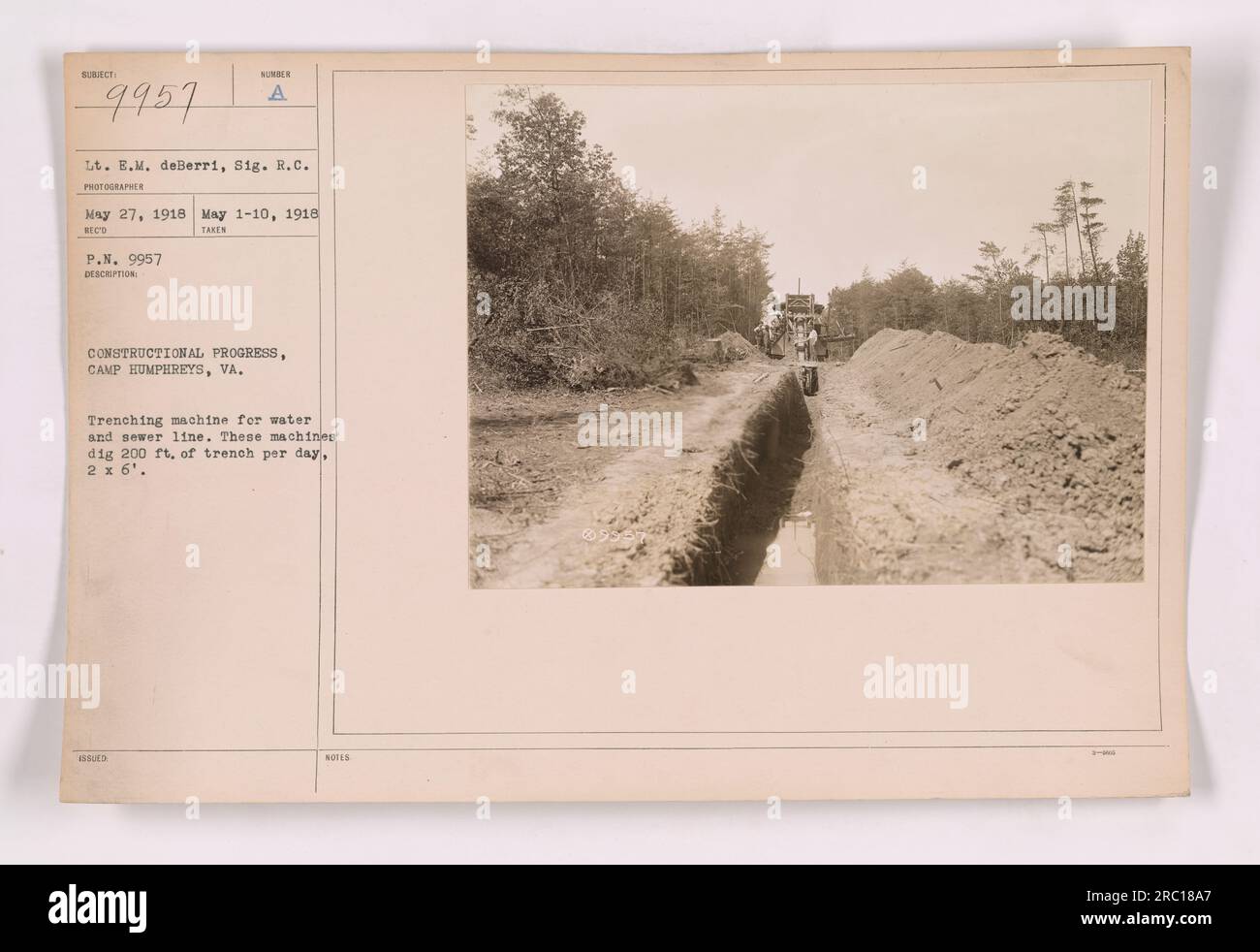 The image shows a trenching machine used for the construction of water ...