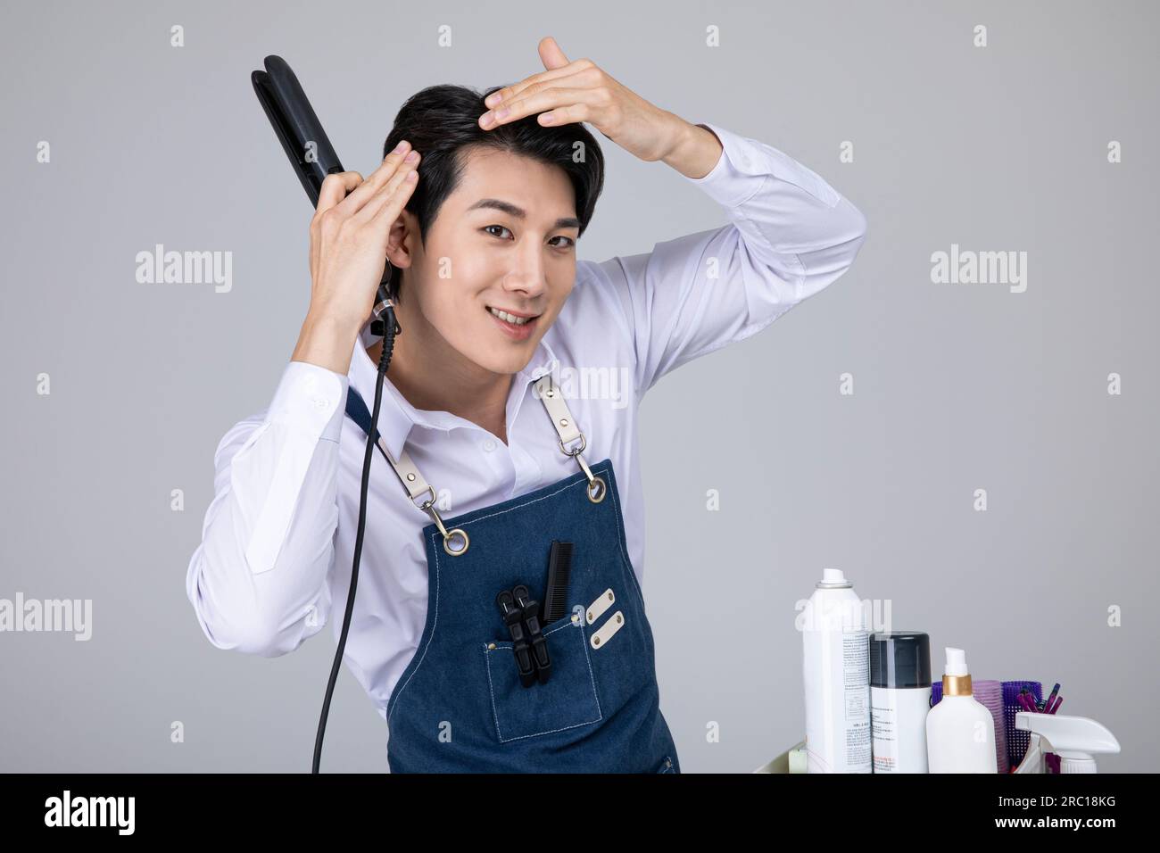 millennials and gen z, korean asian young man grooming his hair Stock ...