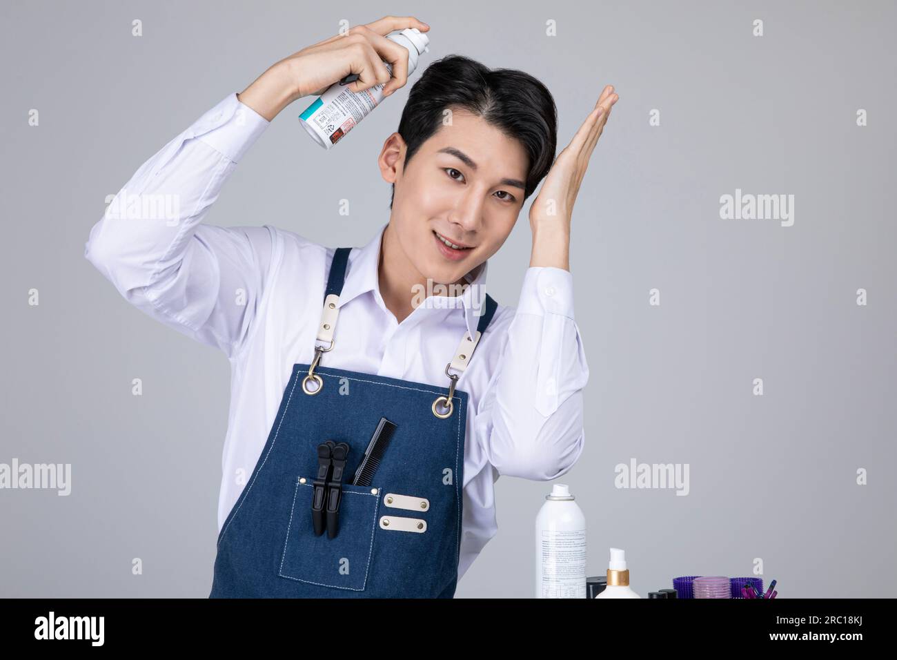 millennials and gen z, korean asian young man grooming his hair Stock ...