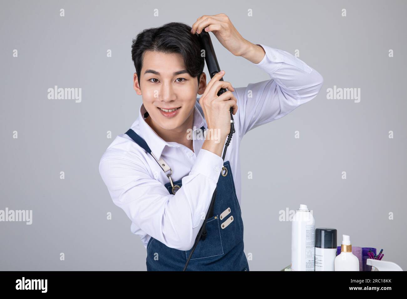millennials and gen z, korean asian young man grooming his hair Stock ...