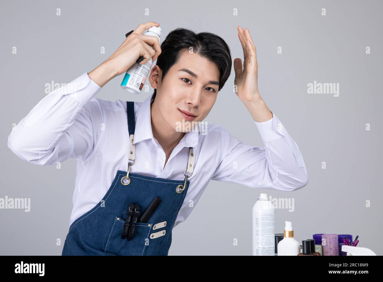 millennials and gen z, korean asian young man grooming his hair Stock ...