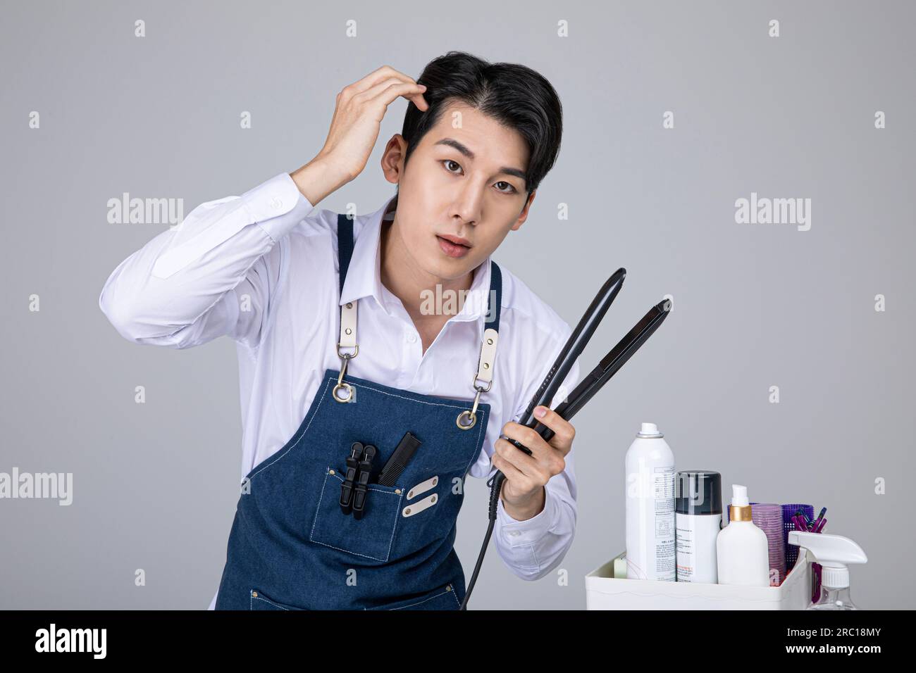 millennials and gen z, korean asian young man grooming his hair Stock ...