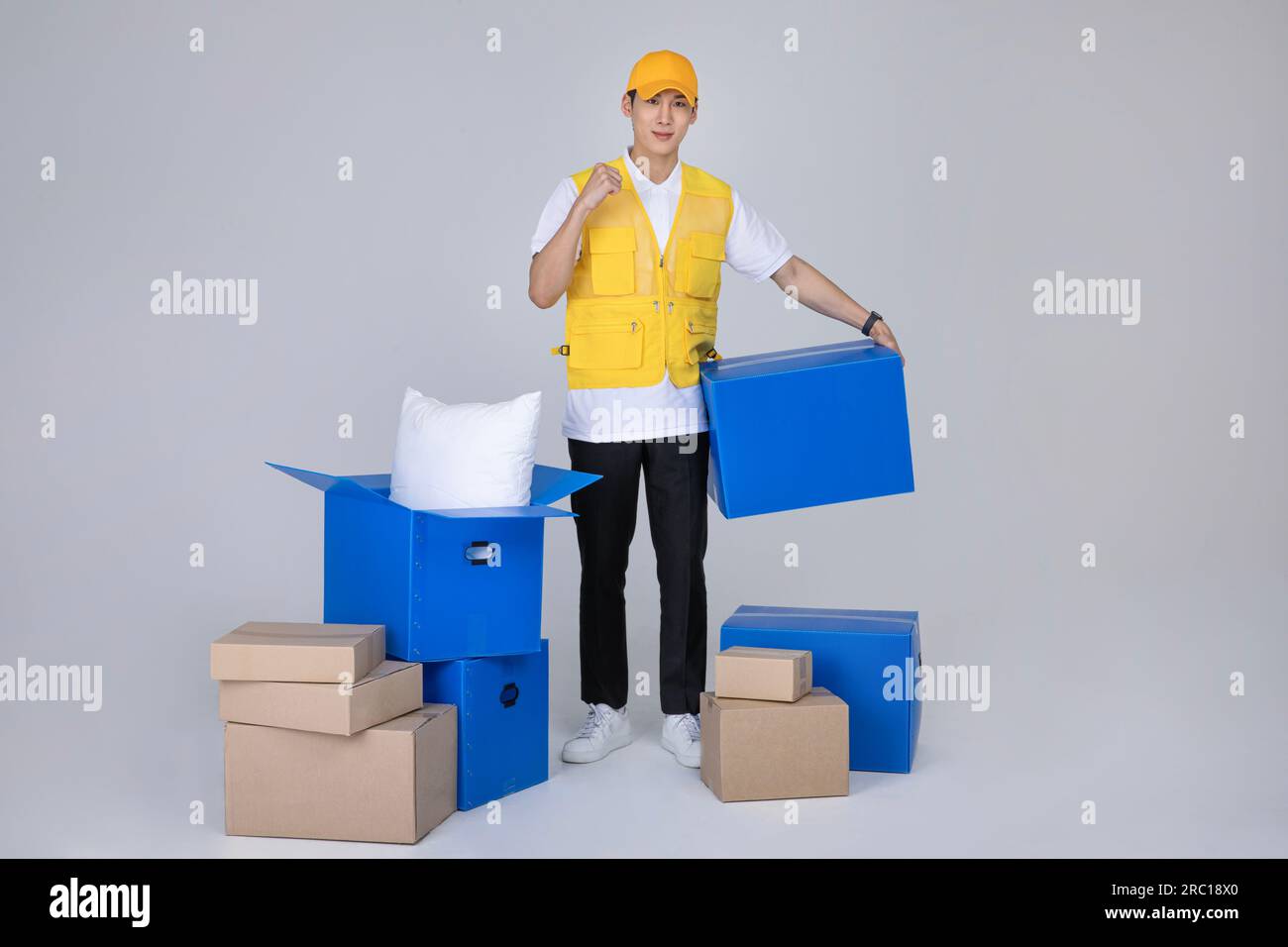 millennials and gen z, korean asian young man organizing moving boxes ...