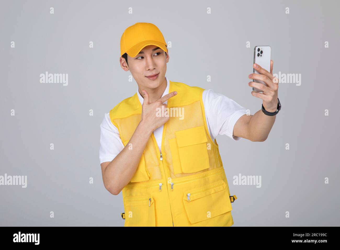 millennials and gen z, korean asian young man taking a picture with a ...