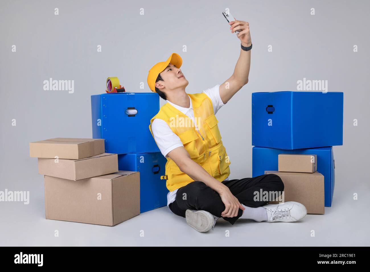 millennials and gen z, korean asian young man resting next to moving ...