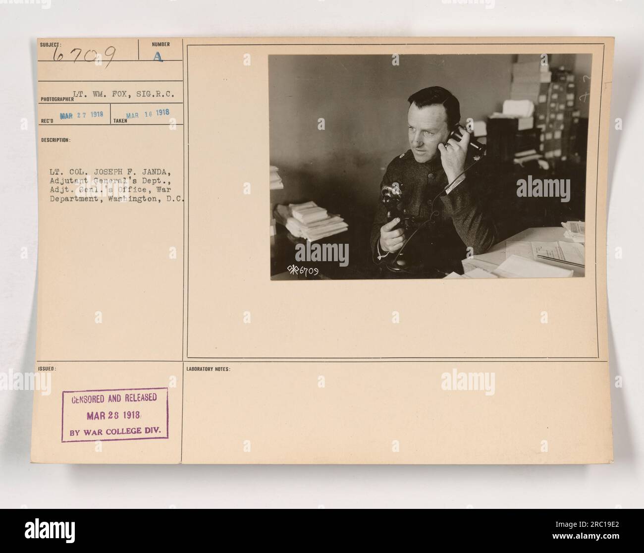 Lt Col Joseph F Janda presents Lt. William Fox of the Signal Corps in ...