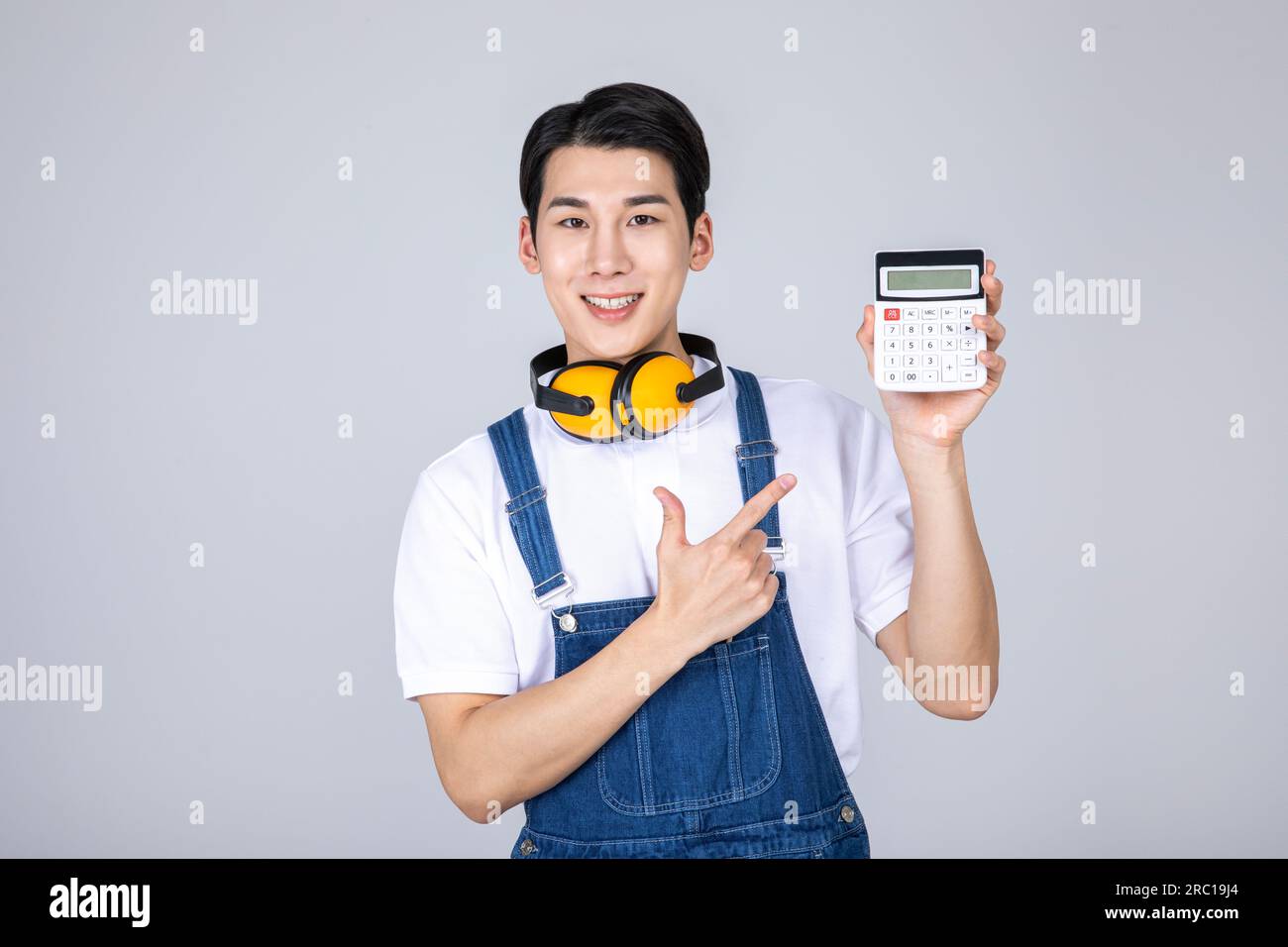 millennials and gen z, korean asian young man carpenter holding a ...