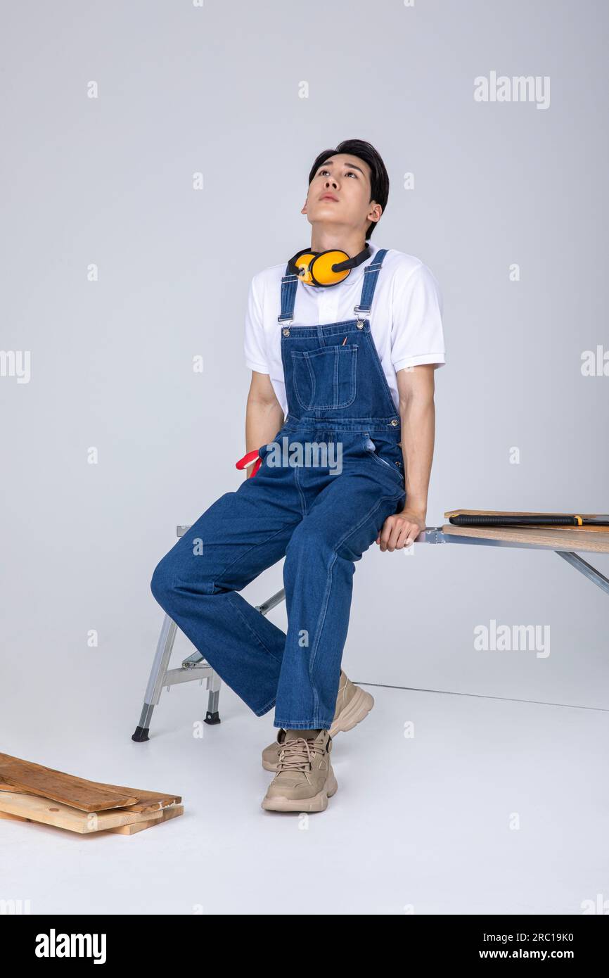 millennials and gen z, korean asian young man carpenter sitting and ...