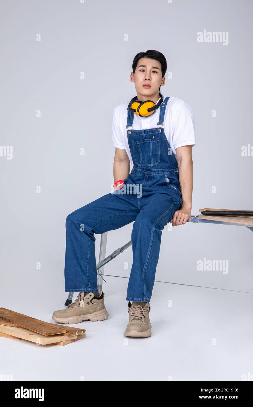 millennials and gen z, korean asian young man carpenter sitting and ...