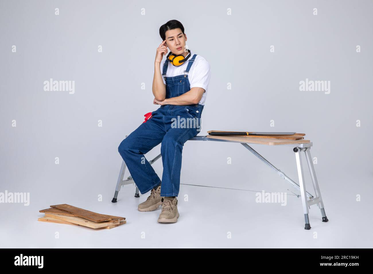 millennials and gen z, korean asian young man carpenter sitting and ...