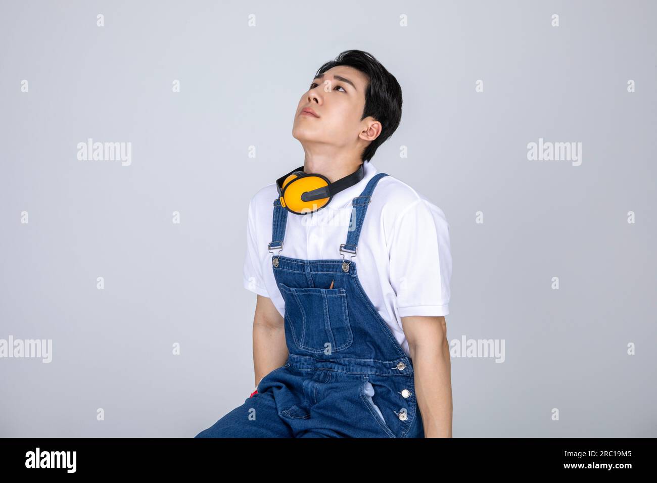 millennials and gen z, korean asian young man carpenter thinking Stock ...