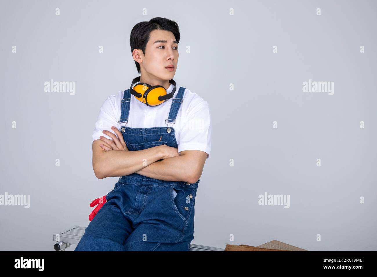 millennials and gen z, korean asian young man carpenter thinking, with ...