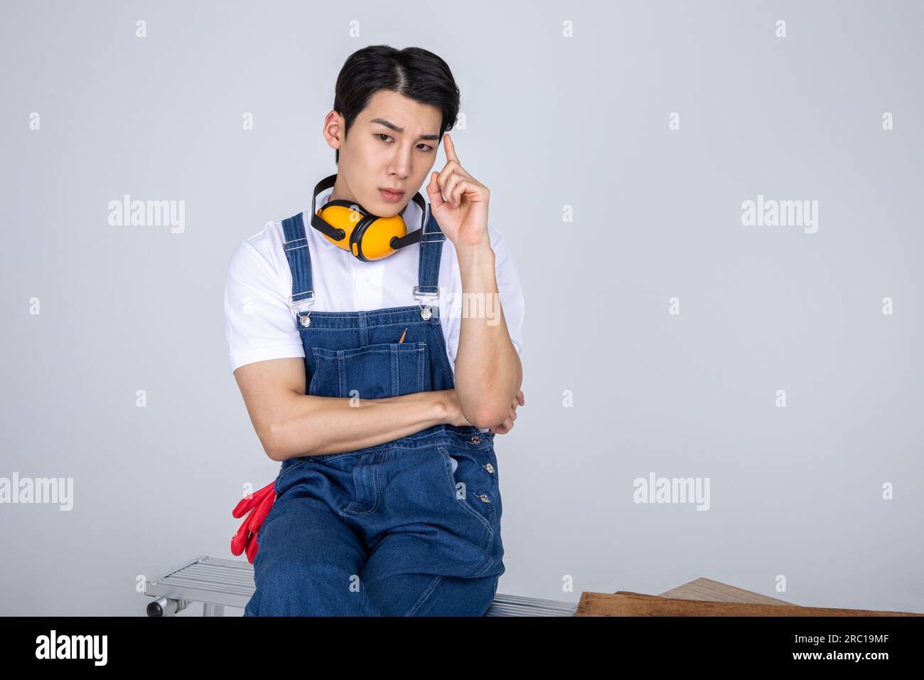 millennials and gen z, korean asian young man carpenter thinking, with ...