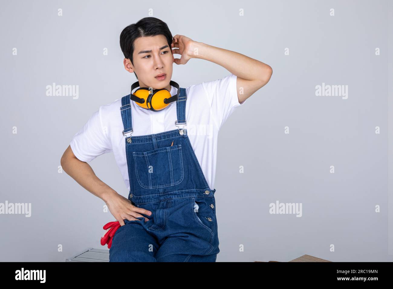 millennials and gen z, korean asian young man carpenter thinking Stock ...