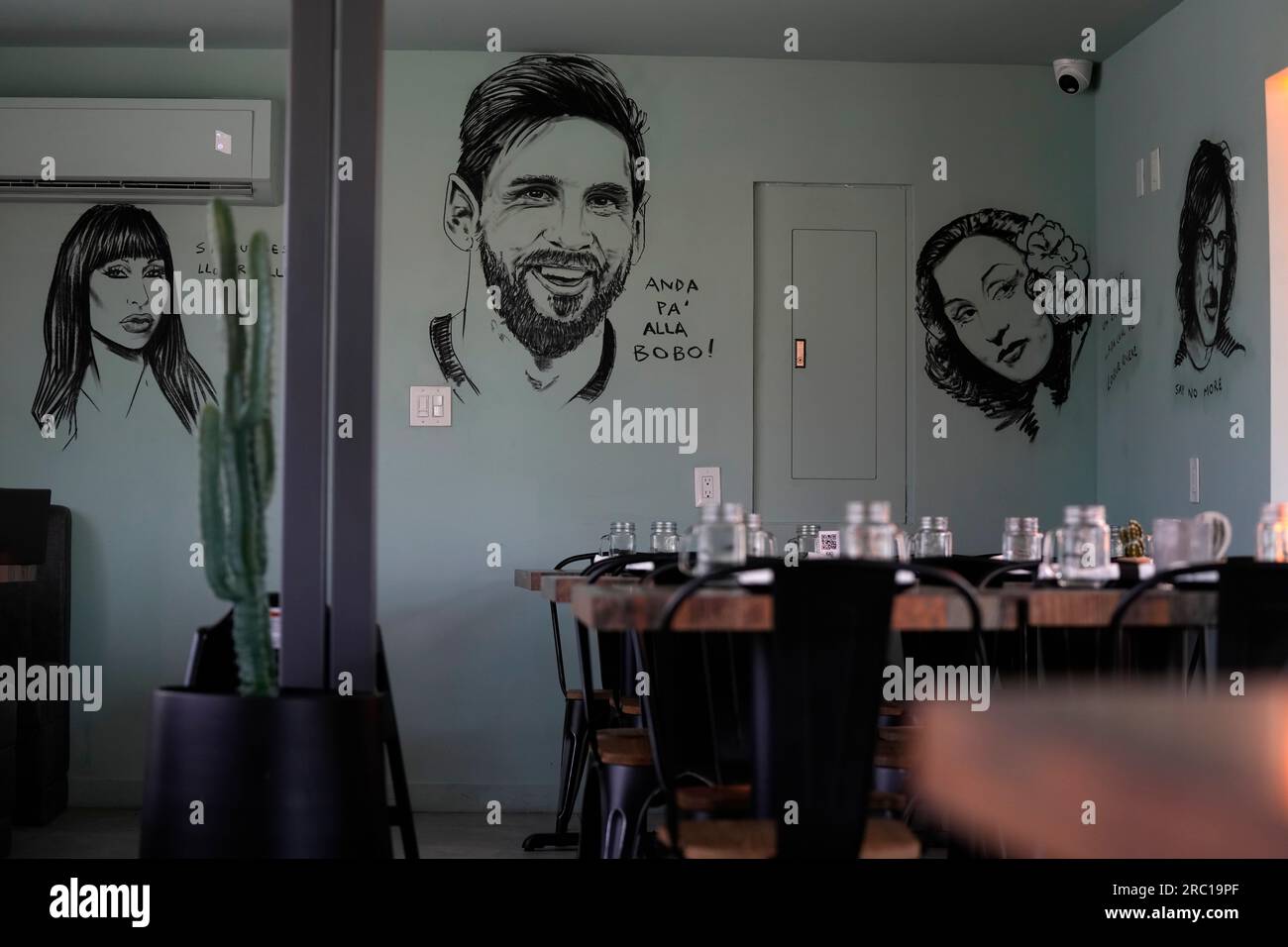 Art depicting Argentine soccer player Lionel Messi adorns the wall at ...