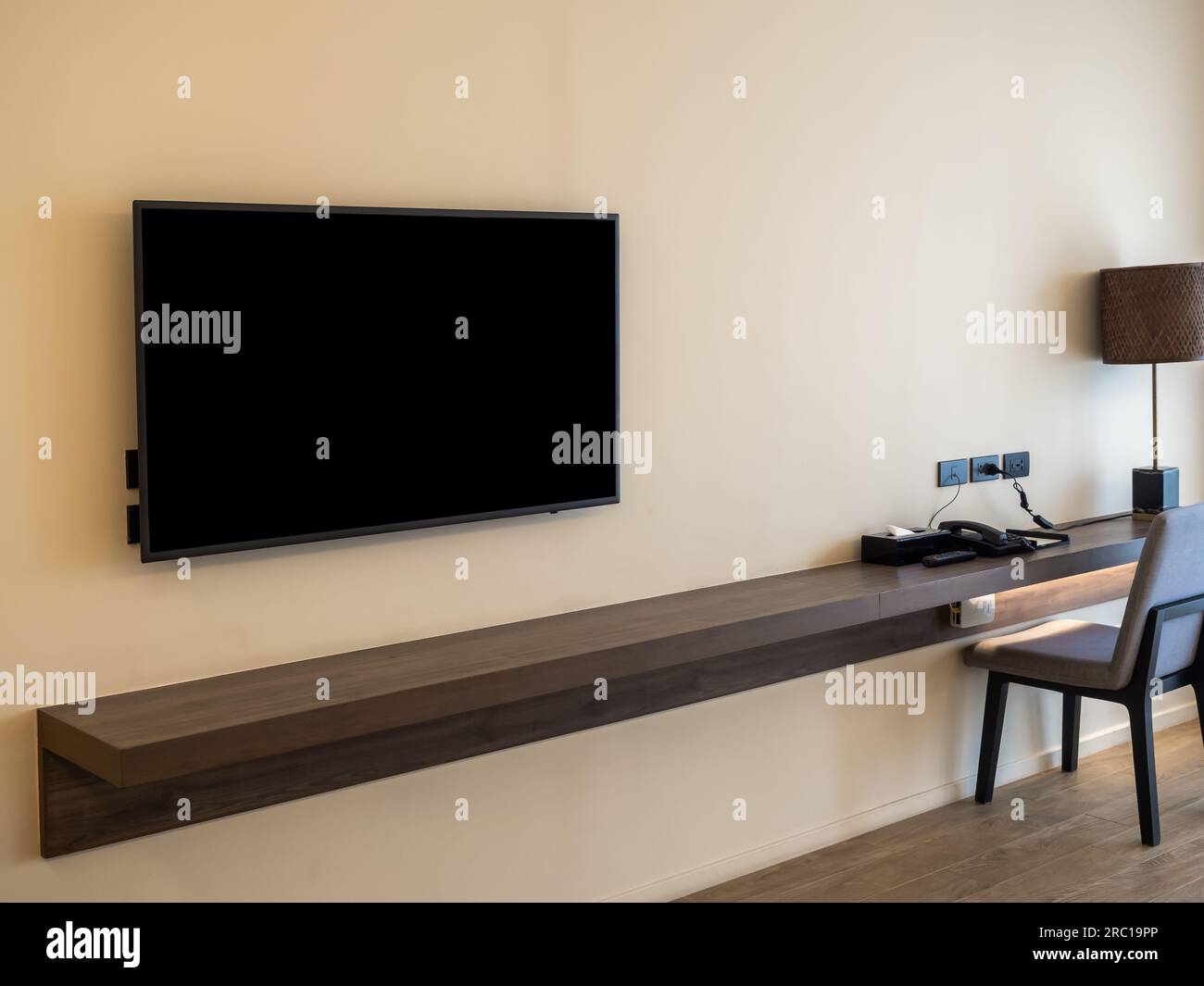 Mockup blank space on smart TV black screen over the empty long brown ...