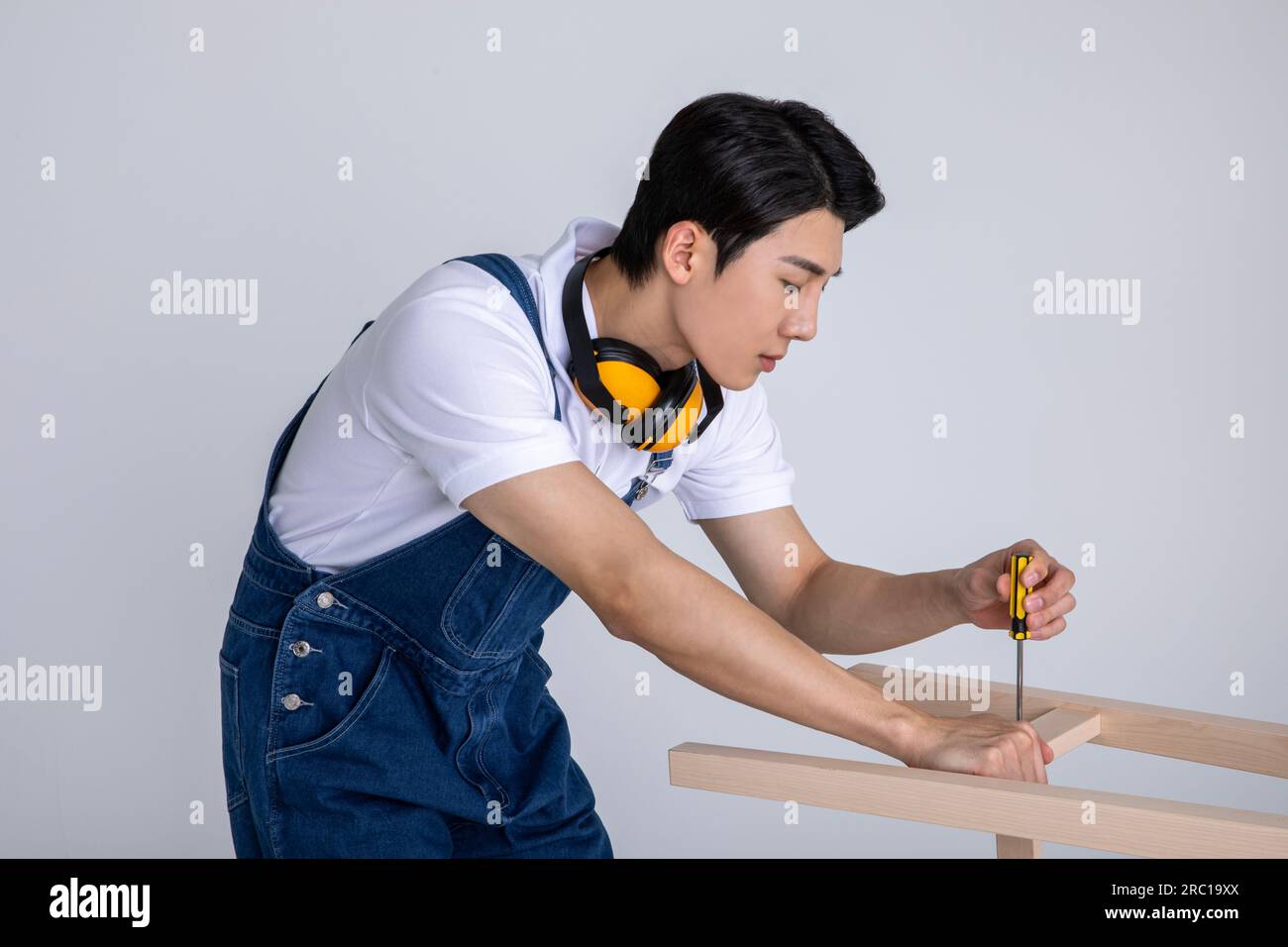 millennials and gen z, korean asian young man carpenter assembling ...